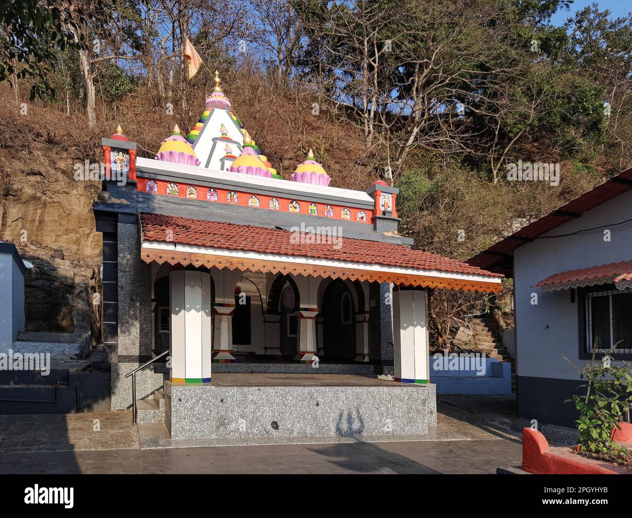 Well decorateda and painted temple of Shiva God at Chaul near Alibag ...