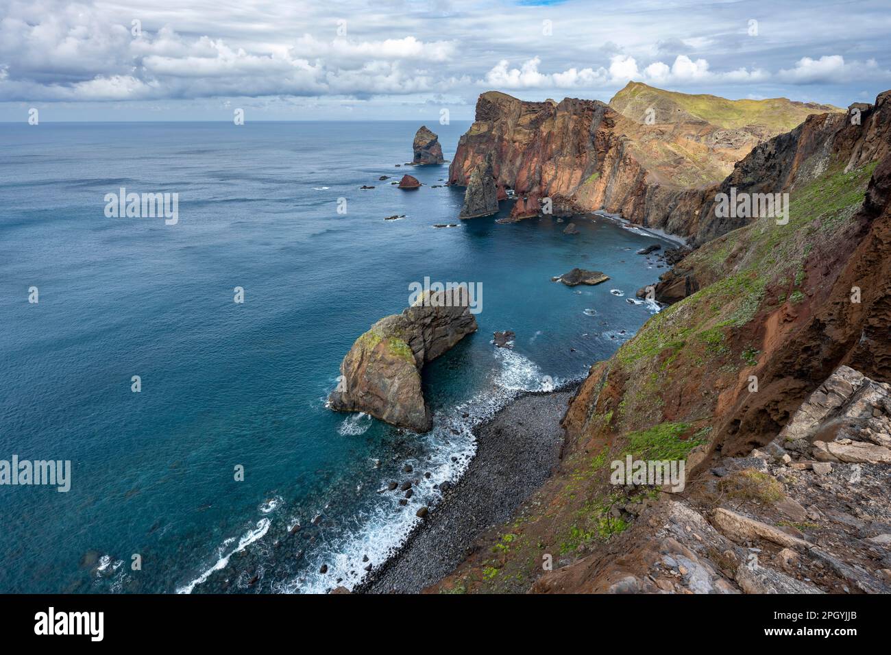 Red cliffs and rocks in the sea, coastal landscape, Ponta de Sao ...