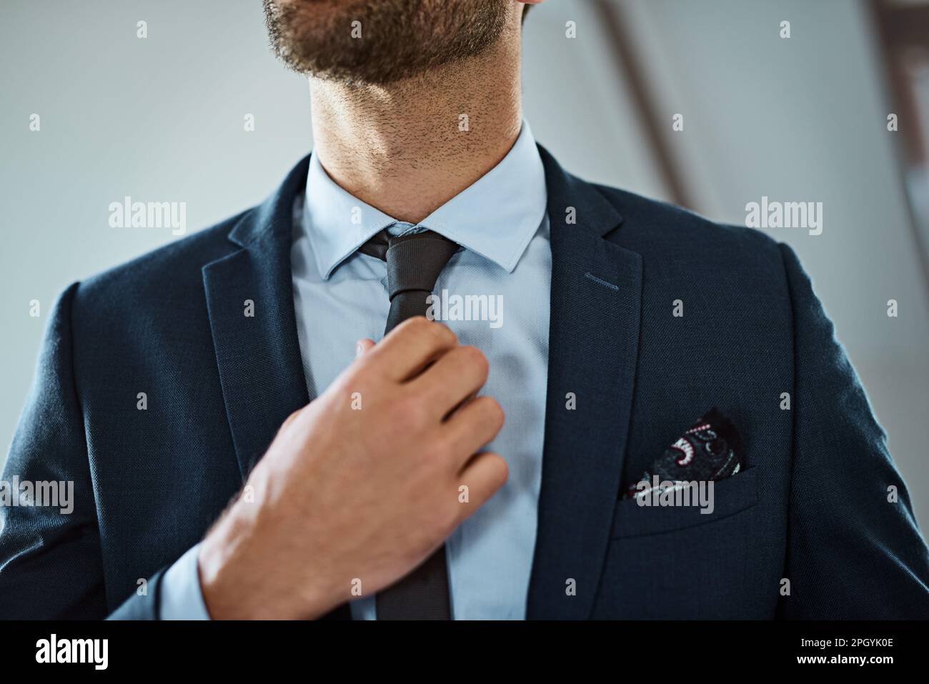 It must be perfect. an unrecognizable man dressing himself at home ...