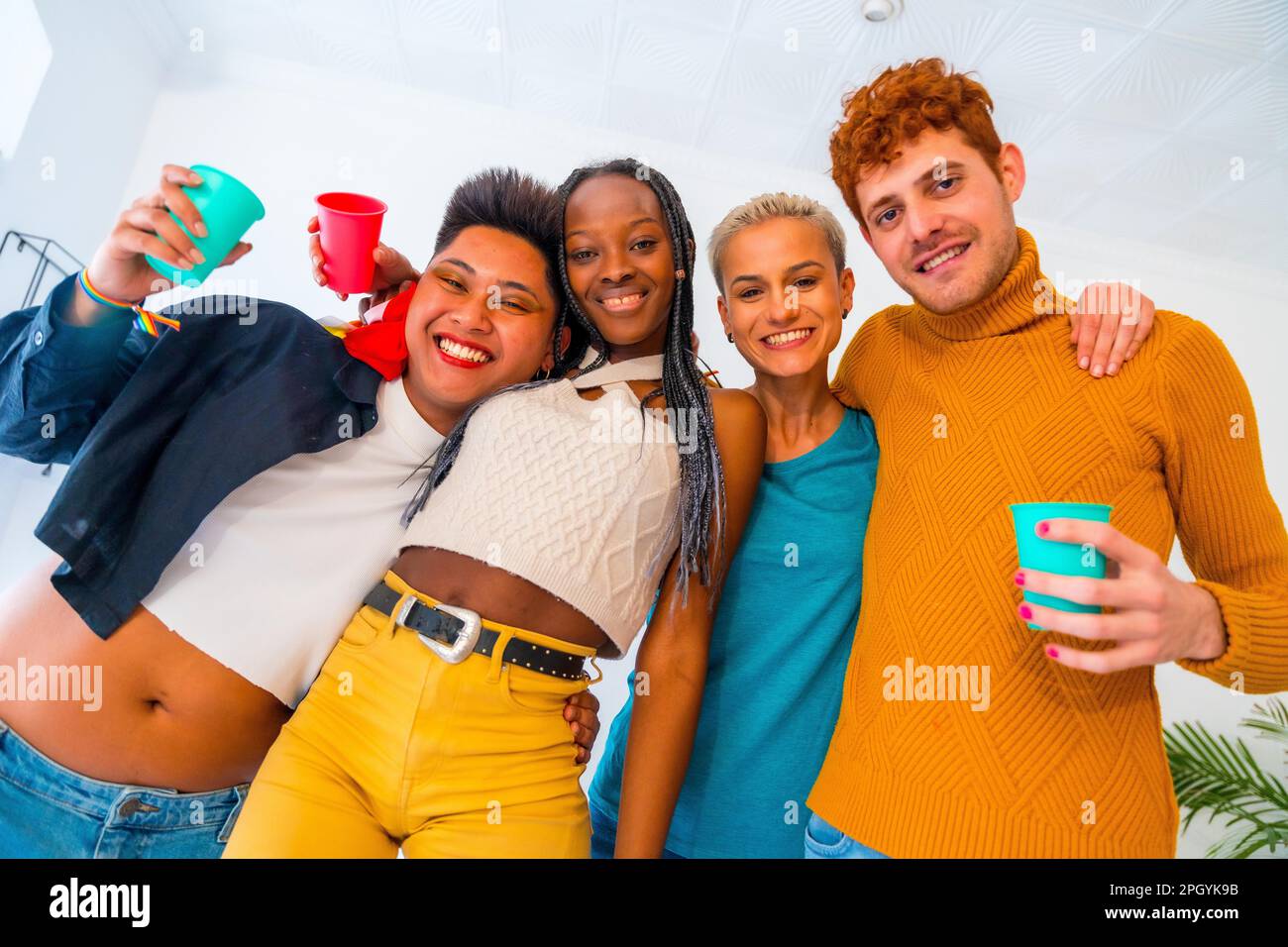 LGBT pride, lgbt rainbow flag, portrait of group of friends dancing in ...