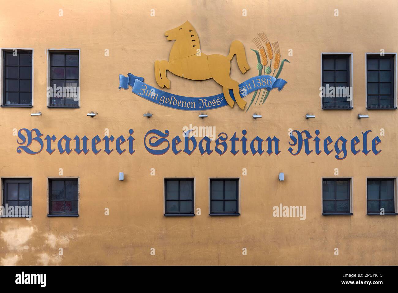Factory facade with the symbol of the traditional Riegele Brewery ...