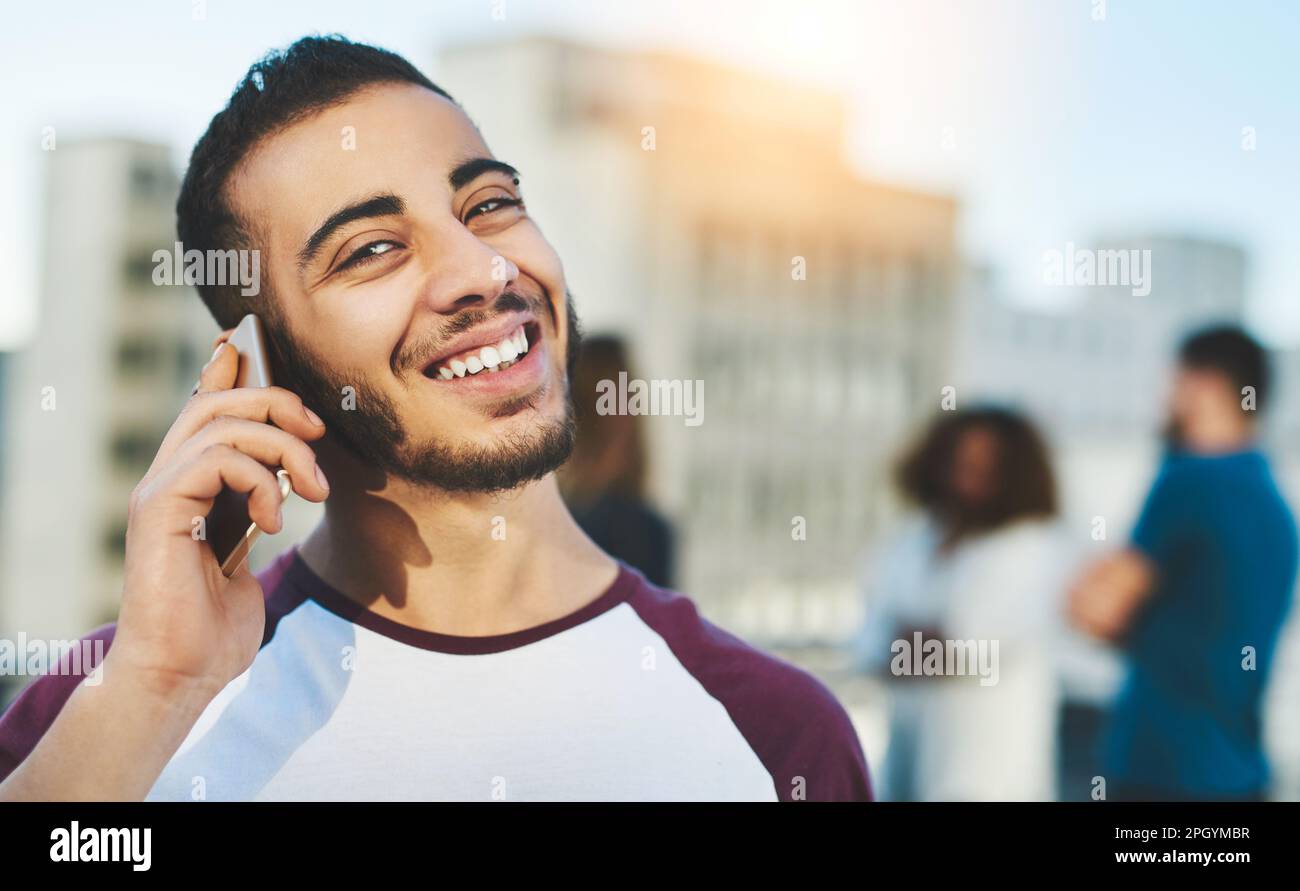 Its an important call. Cropped portrait of a handsome young man making ...