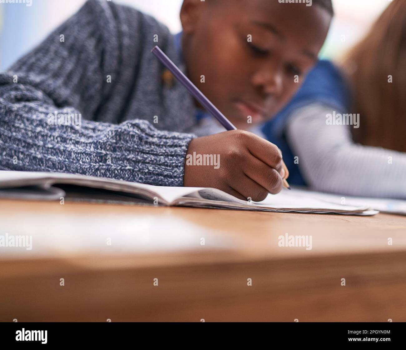 Hes focused on the work. elementary school children in class Stock ...