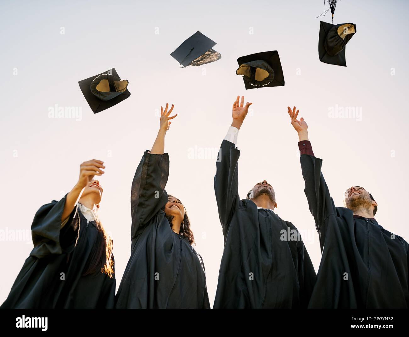 Even if its tough, you can still triumph. a group of students throwing ...