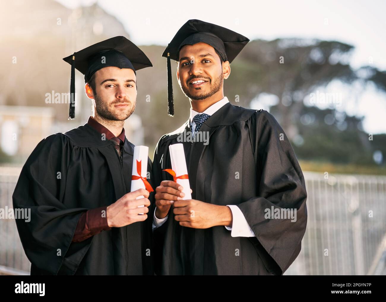 Its our greatest victory. Portrait of two students holding their ...
