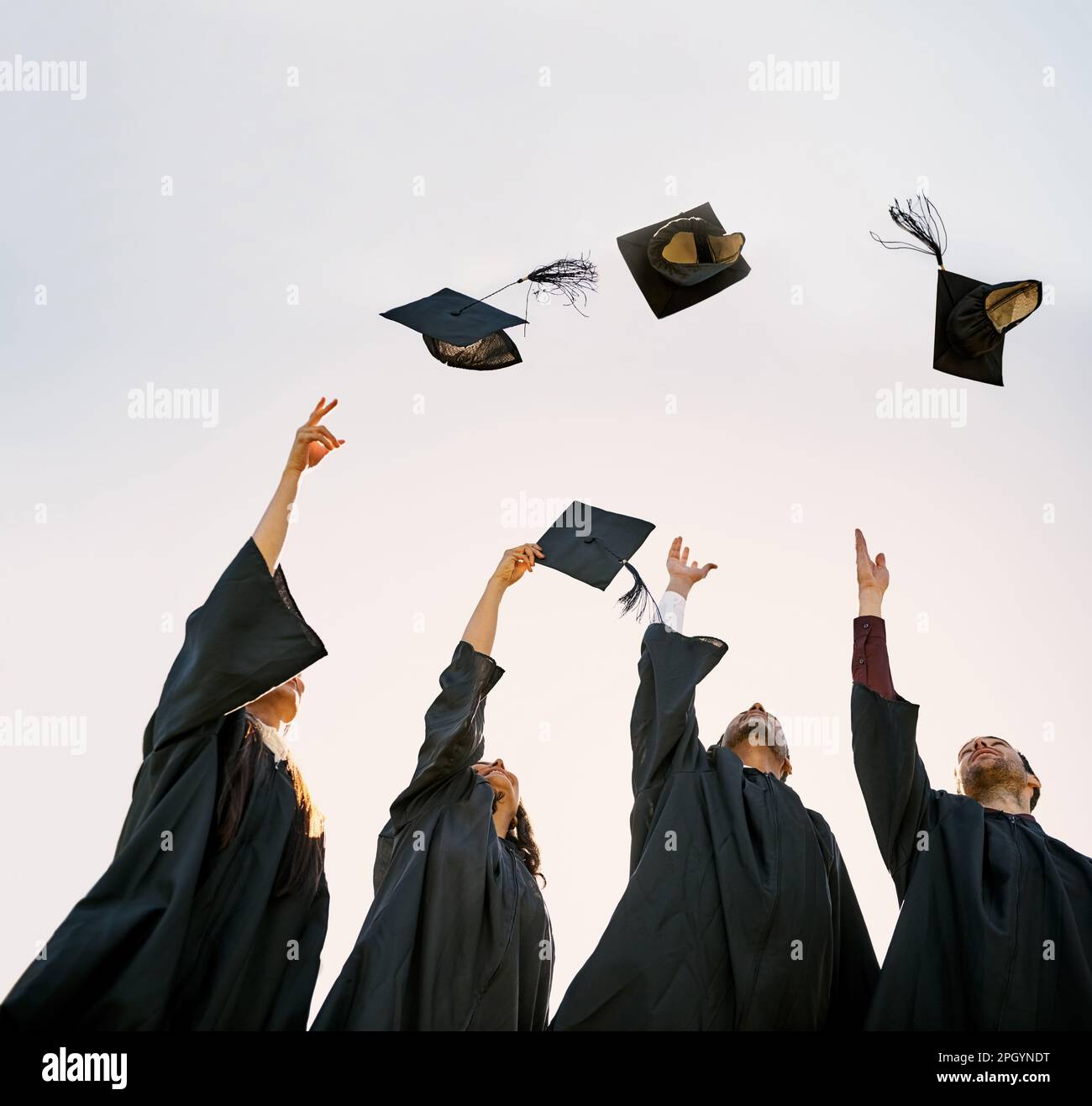 Celebrating the end of their academic years. a group of students ...