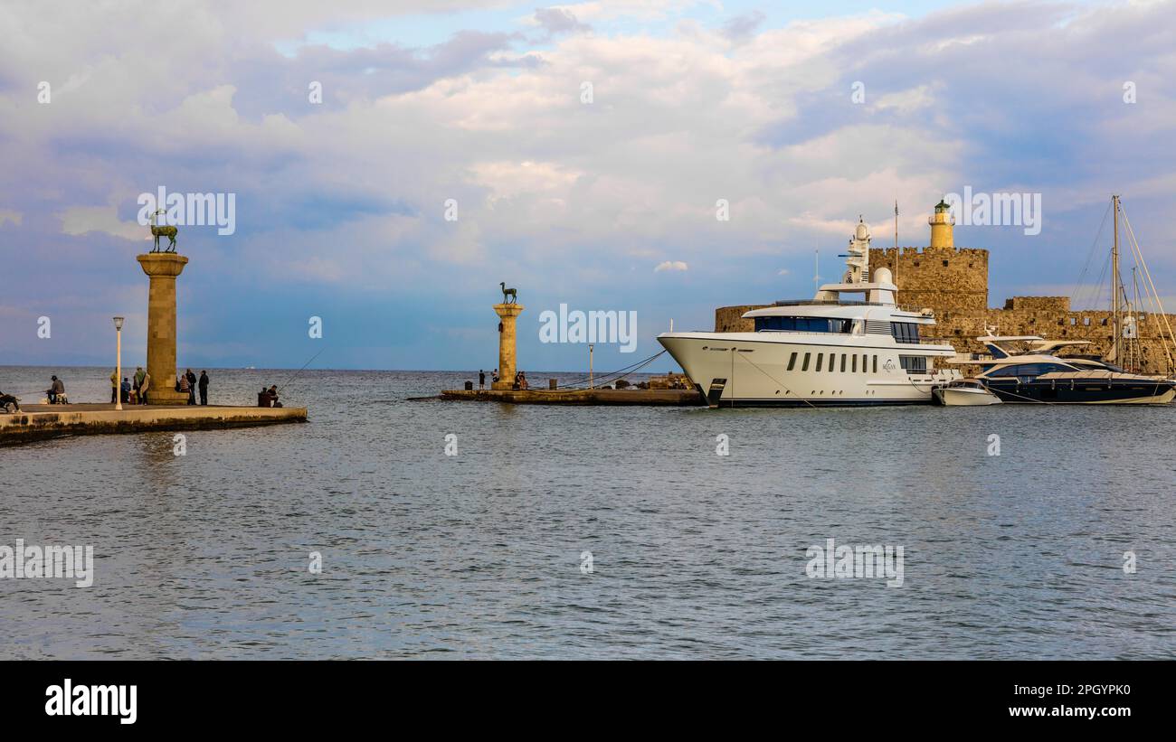 Mandraki harbour, harbour entrance with columns with stag and hind ...