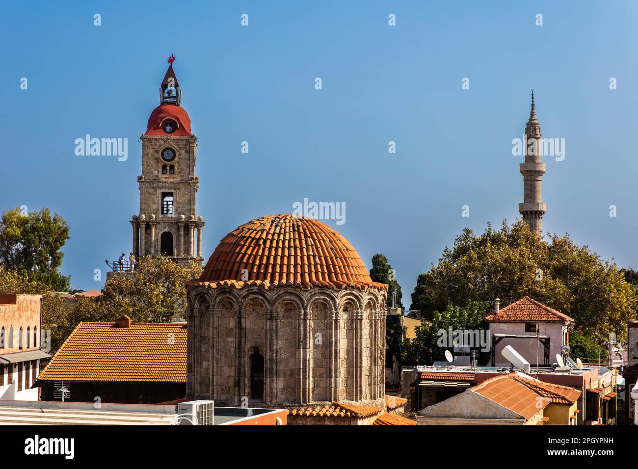 View of Byzantine Agios Georgios Church and clock tower and minaret of ...