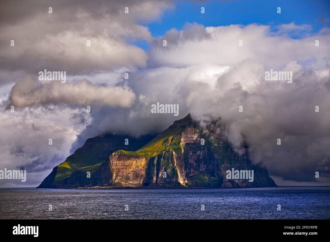The island of Kalsoy in the North Atlantic with sun and clouds, Faroe ...