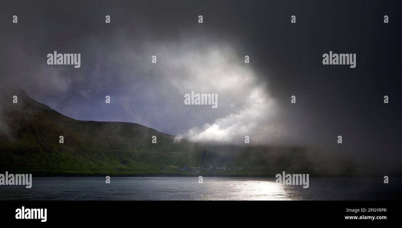 The island of Kalsoy with the small village of Mikladalur in the North ...