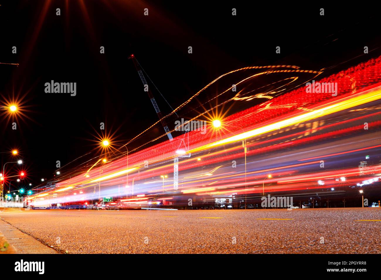 Light trails from fast cars on a night out in the city outside a ...