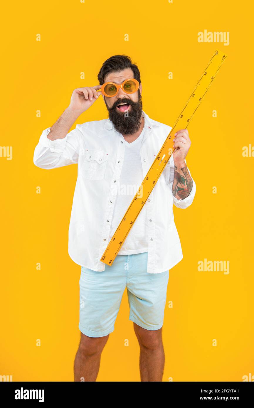 photo of amazed school man measure with ruler. school man measure with ...