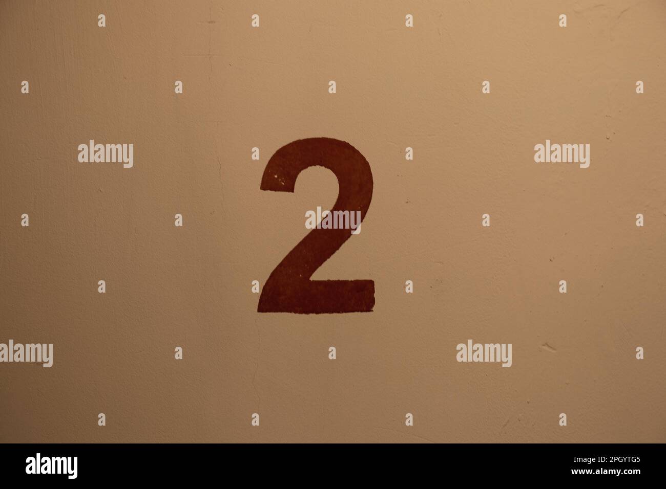 the red number two is painted on the wall of the staircase on the ...
