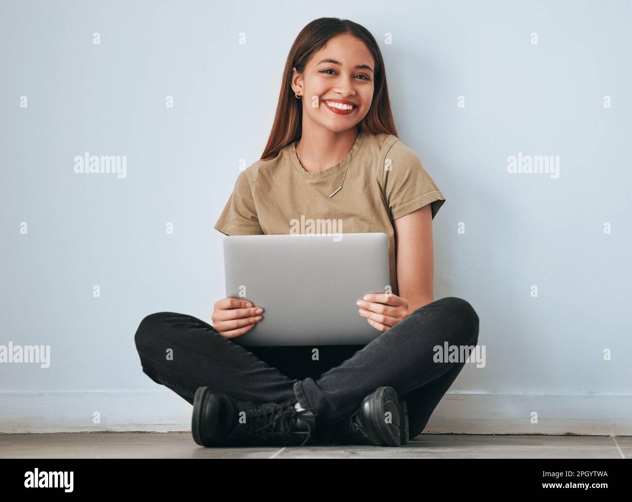 Portrait, smile and student woman with laptop in home for studying ...
