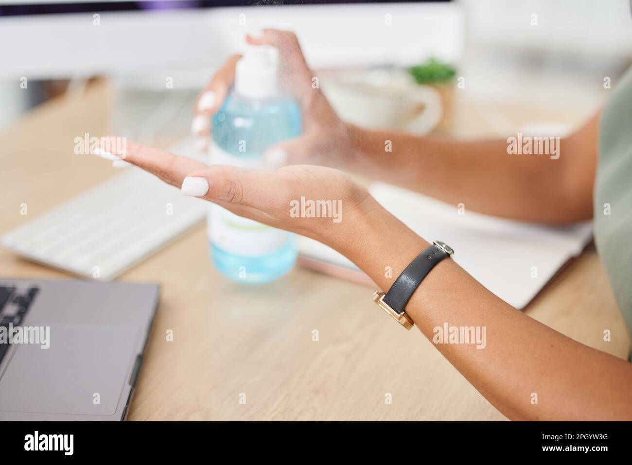 Hands, covid or sanitizer and a business woman cleaning for hygiene or ...