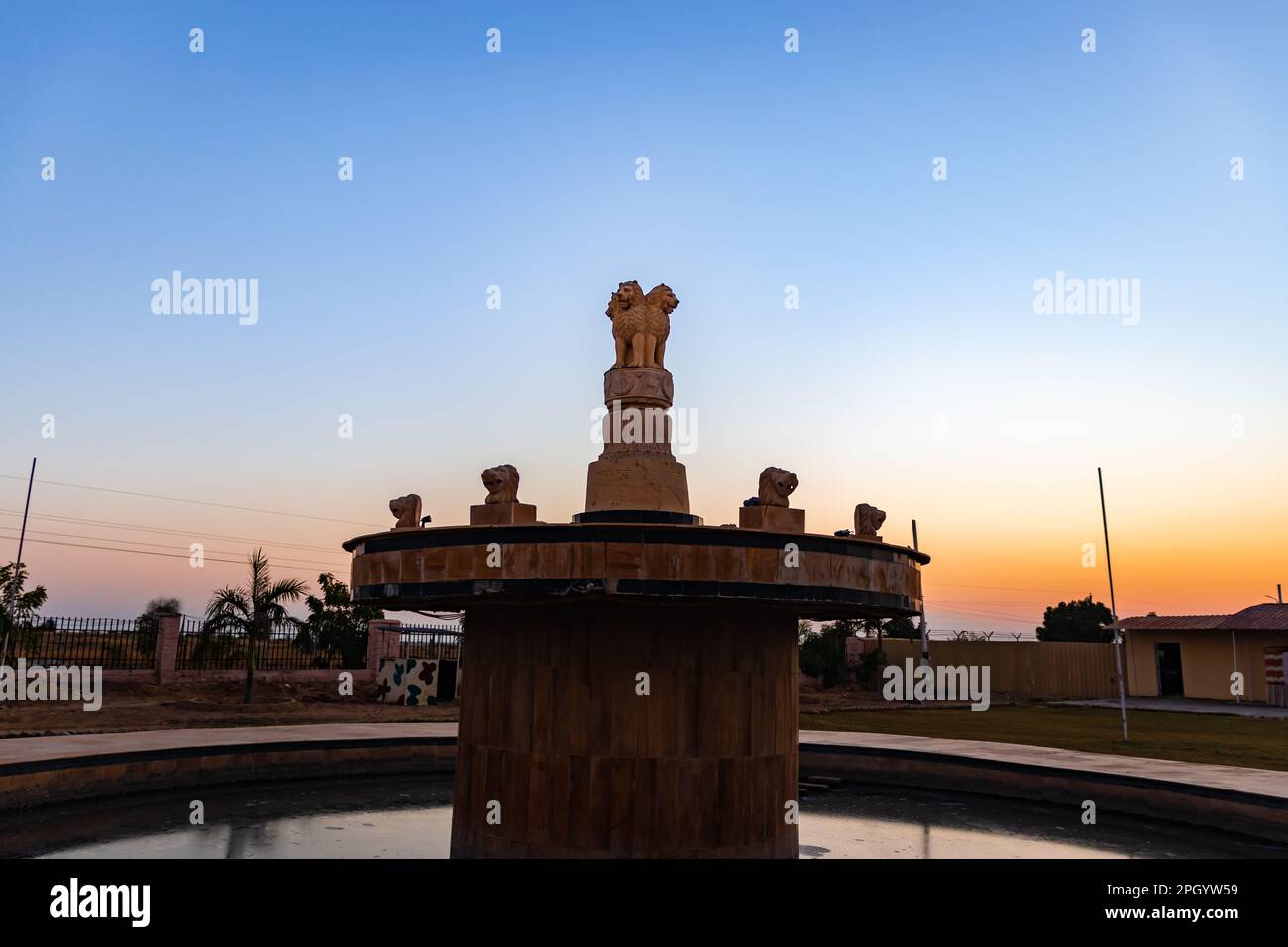 indian national emblem with bright dramatic sky at evening from ...