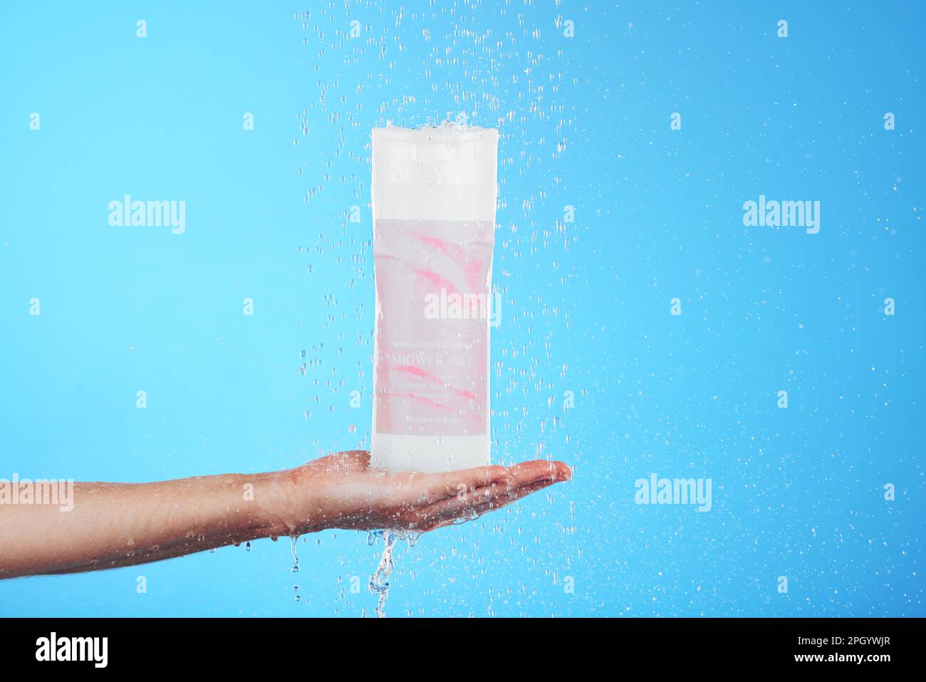 Shampoo, showing and hand with a bottle in the shower isolated on a ...