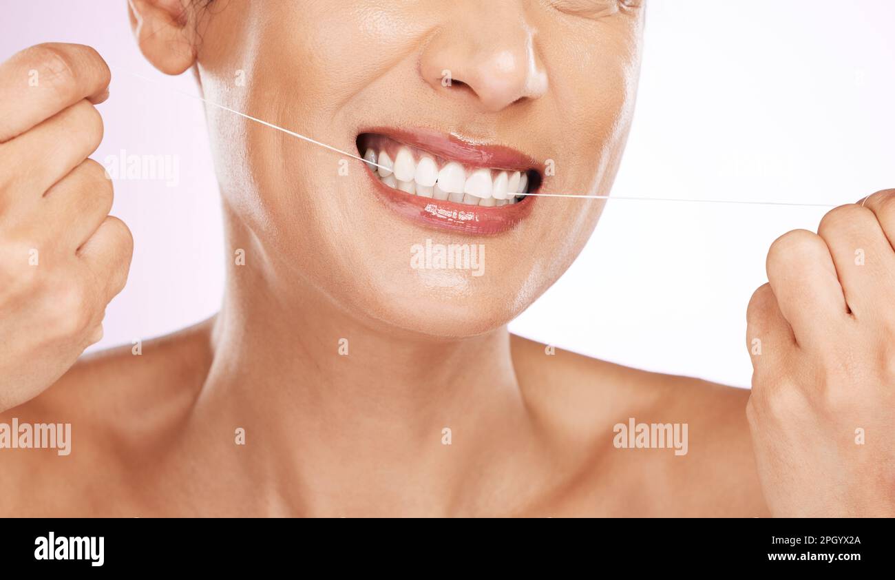 Face, smile and woman flossing teeth for cleaning, hygiene or tooth ...