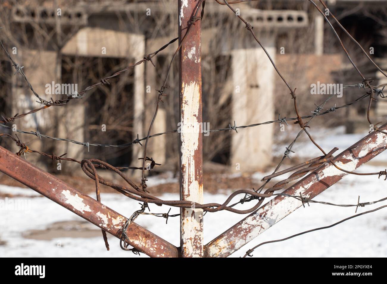 old rusty fence with barbed wire, closed area Stock Photo - Alamy
