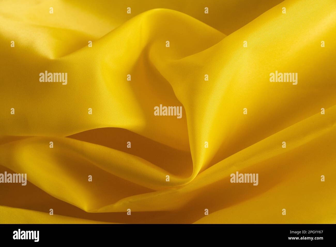 Yellow wrinkled fabric hi-res stock photography and images - Alamy