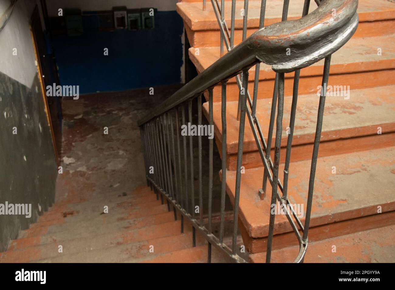 old soviet dirty dark staircase at the entrance of an apartment ...