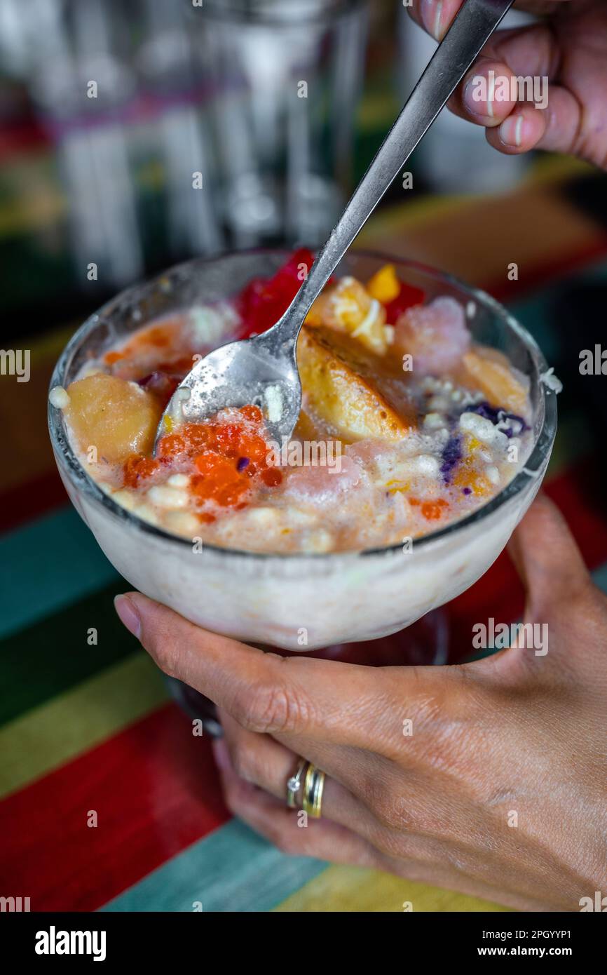 Halo-halo is a colorful Filipino beverage of crushed ice an mixtures of ...