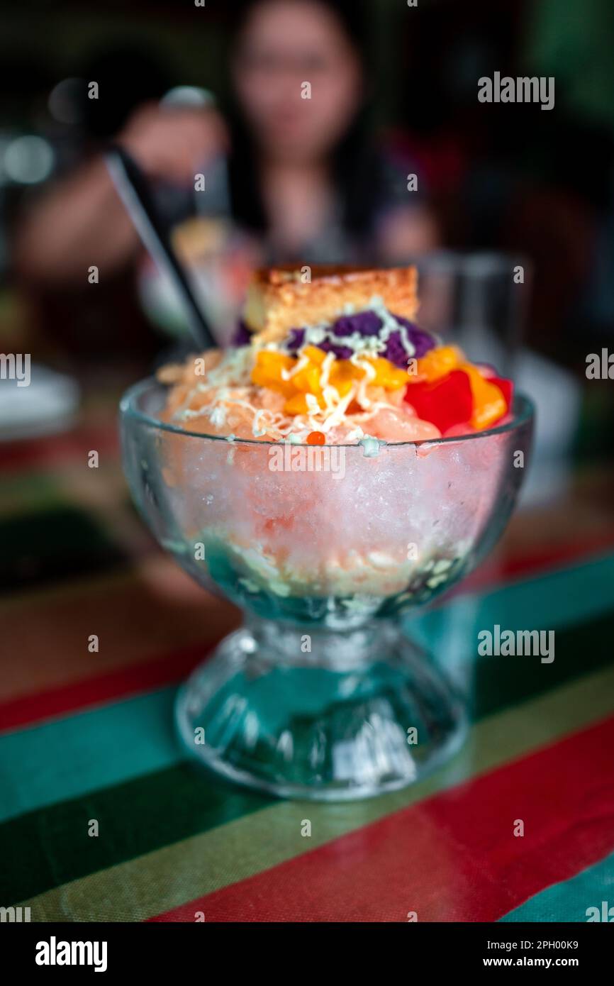 Halo-halo is a colorful Filipino beverage of crushed ice an mixtures of ...