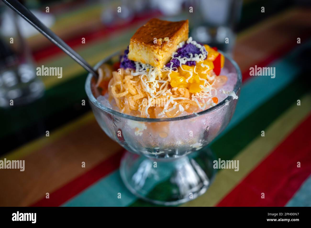 Halo-halo is a colorful Filipino beverage of crushed ice an mixtures of ...