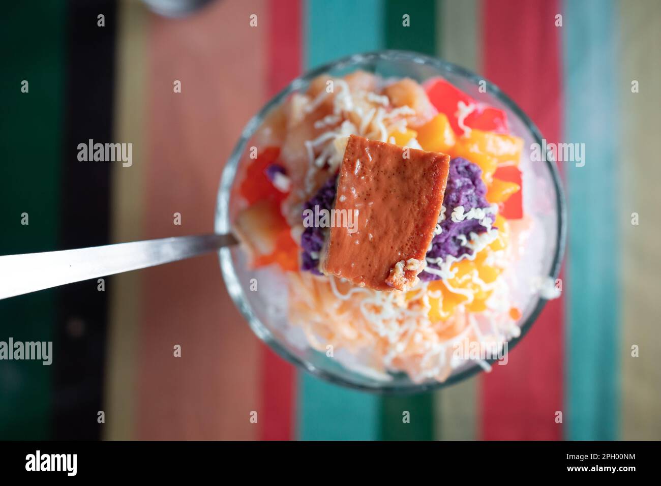 Halo-halo is a colorful Filipino beverage of crushed ice an mixtures of ...