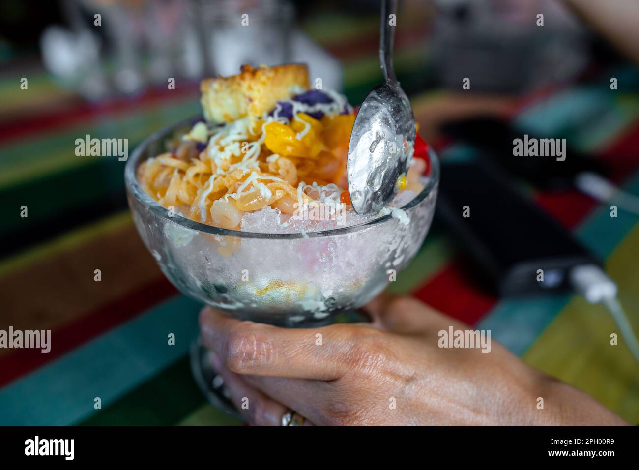 Halo-halo is a colorful Filipino beverage of crushed ice an mixtures of ...