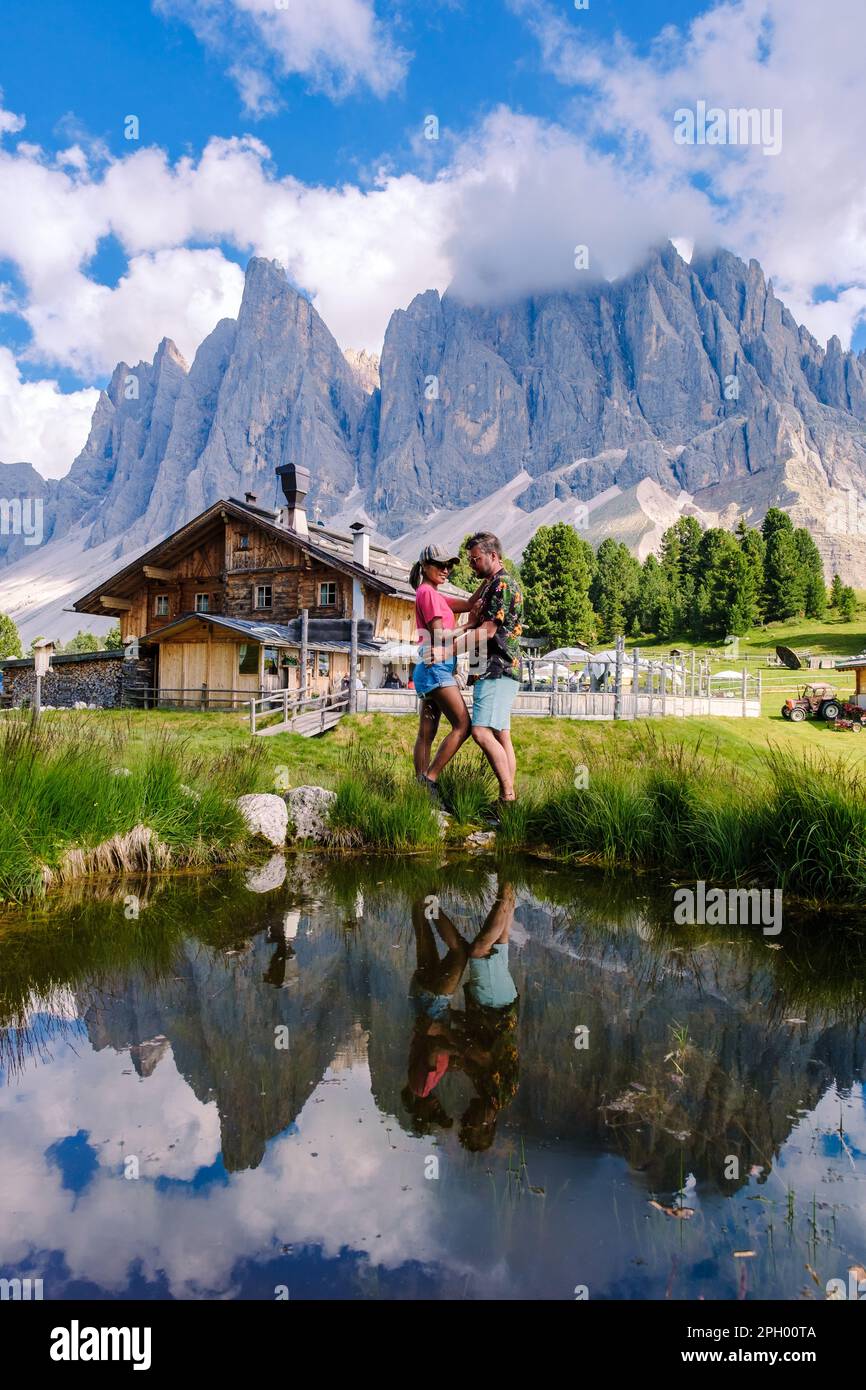 Couple men and women at Geisler Alm, Dolomites Italy, hiking in the ...