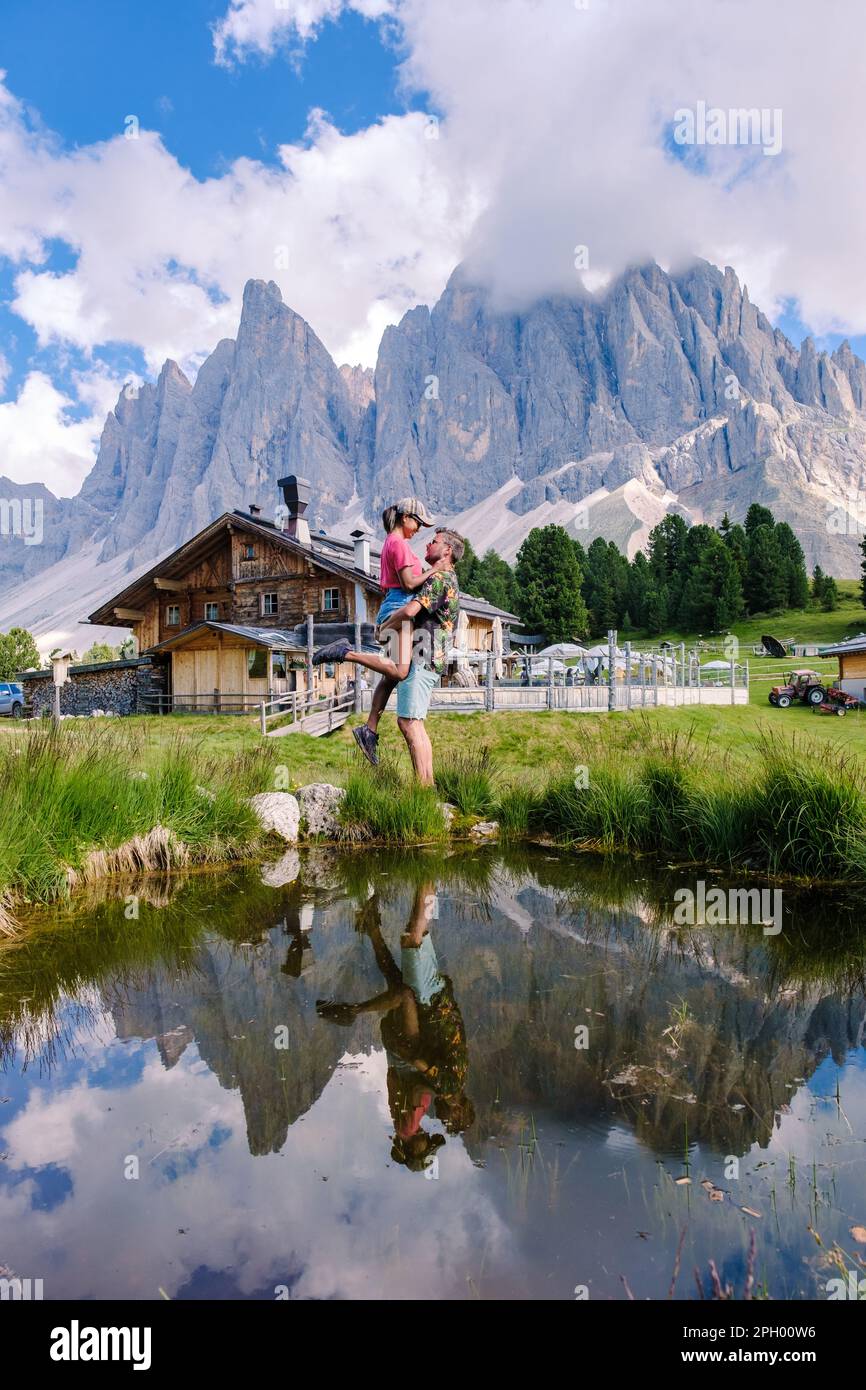 Couple men and women at Geisler Alm, Dolomites Italy, hiking in the ...