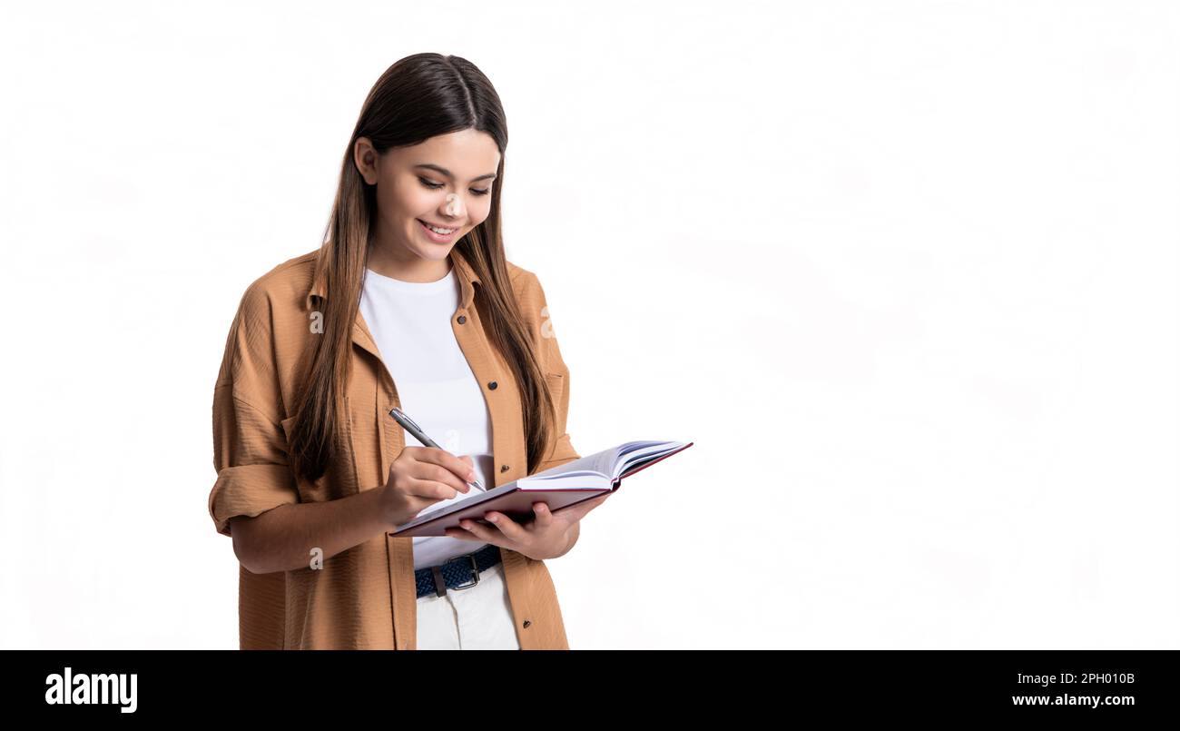 teen girl noting school diary book, copy space. photo of teen girl ...