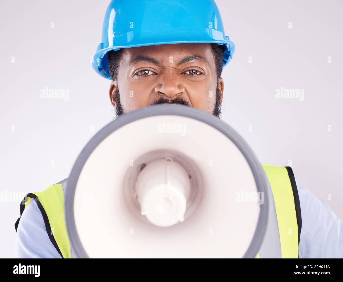 Engineering black man, megaphone and construction in studio portrait ...