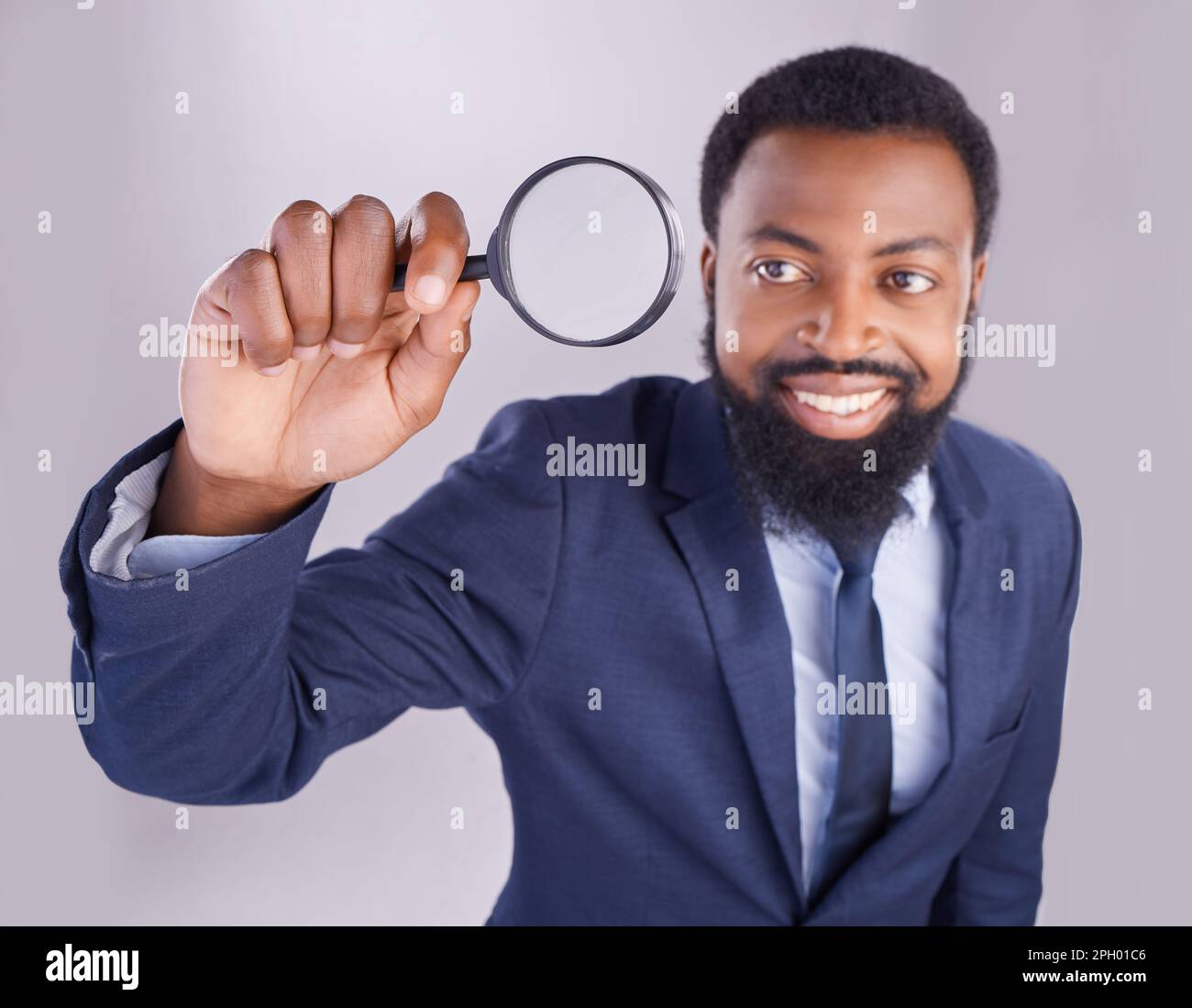 Corporate black man, magnifying glass and studio with smile for quality ...