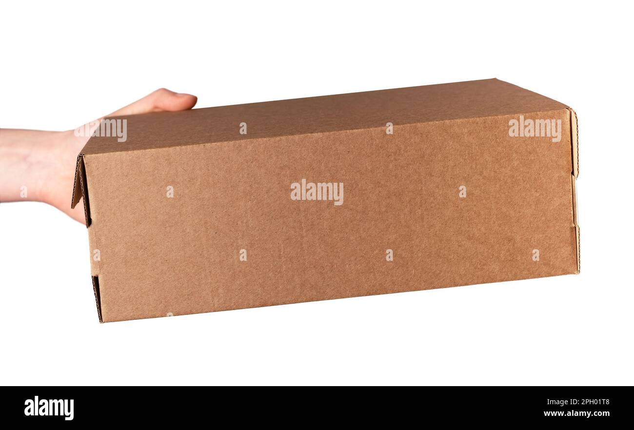 Hand holding, giving brown kraft cardboard box isolated on white ...