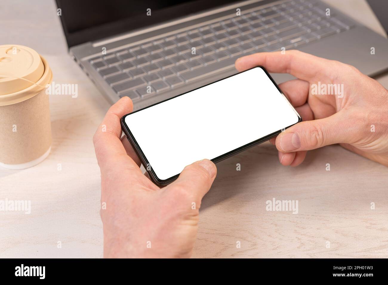 Hand holding horizontal mobile phone mockup, smartphone screen mock-up for watching video ...