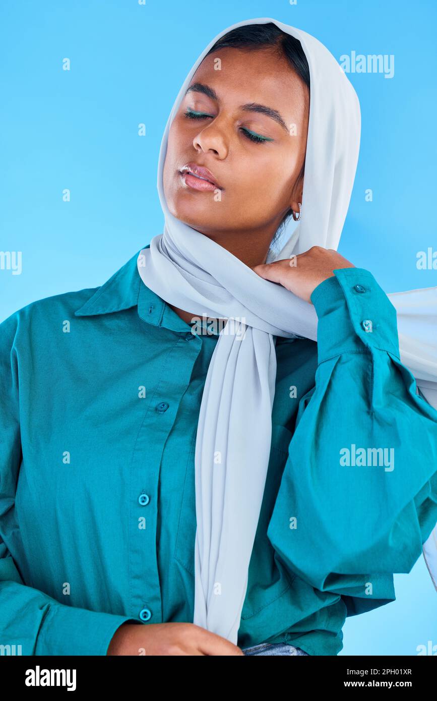 Calm muslim, woman and beauty of hijab in studio, blue background or ...