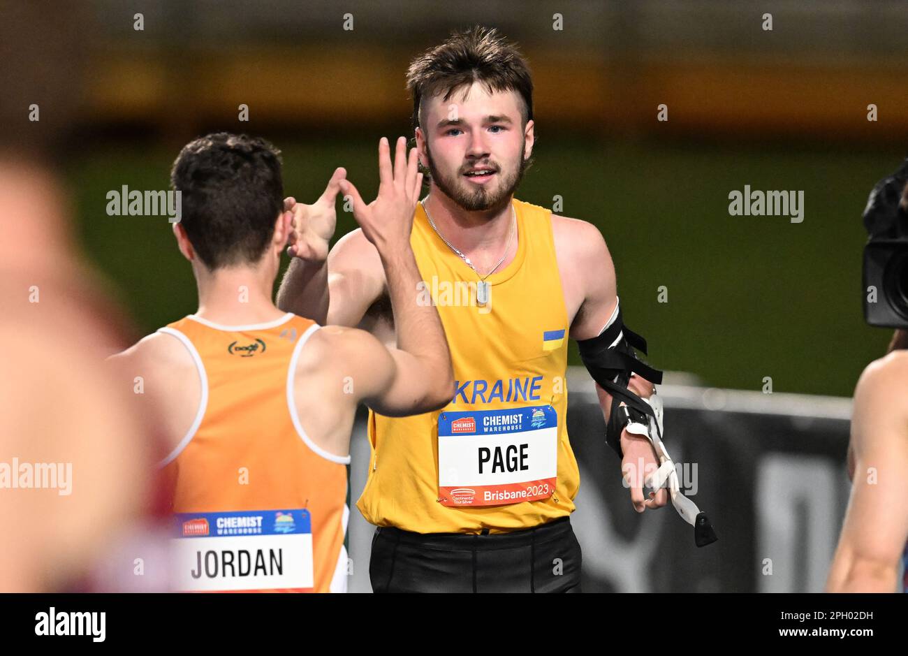 Jayden Page (right) celebrates winning the mens Para Athletes 100 metre ...