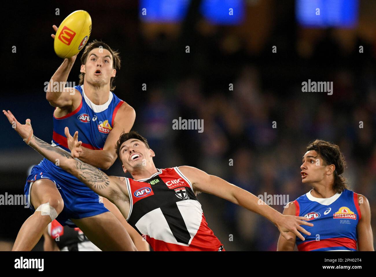 Sam Darcy of the Bulldogs spoils the ball as Josh Battle of the Saints ...