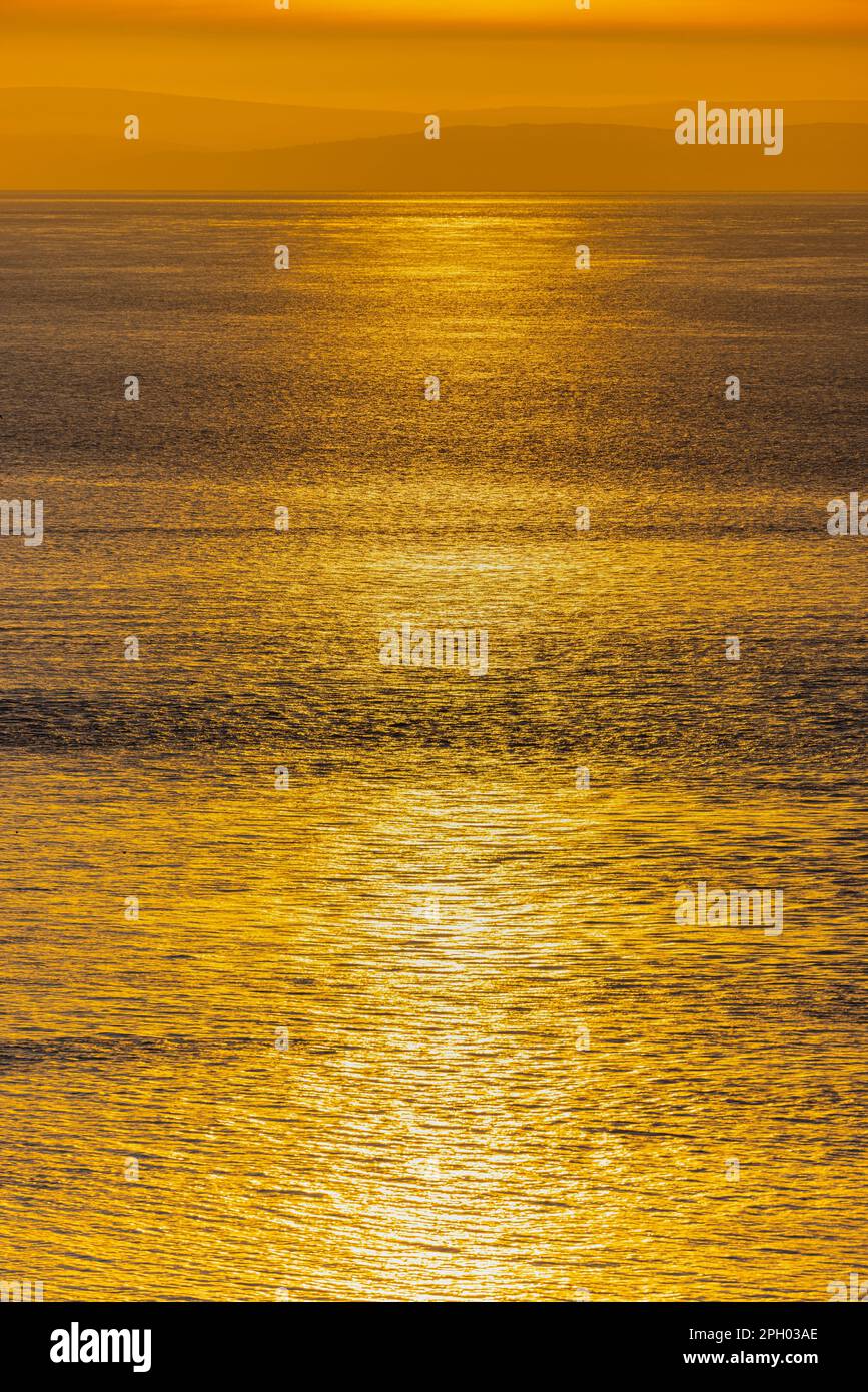 Golden reflection on the sea Stock Photo - Alamy