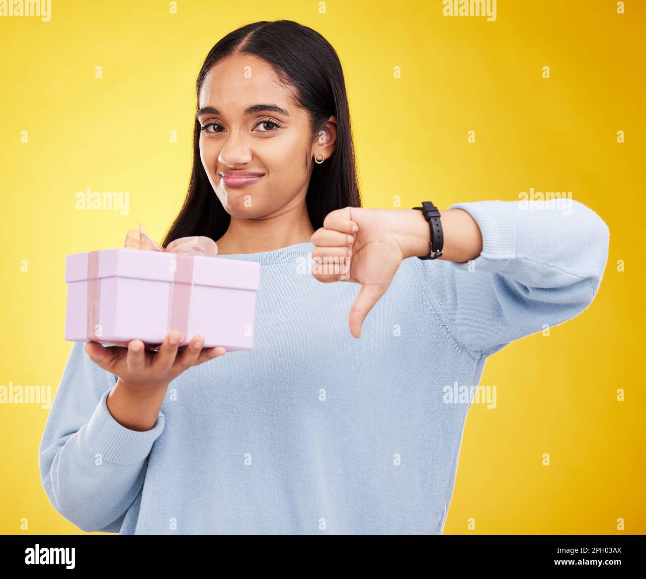 Disappointed girl with a gift box hi-res stock photography and images ...