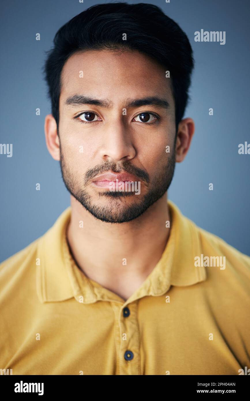 Focus, serious and portrait of a male in studio with moody, sadness or ...