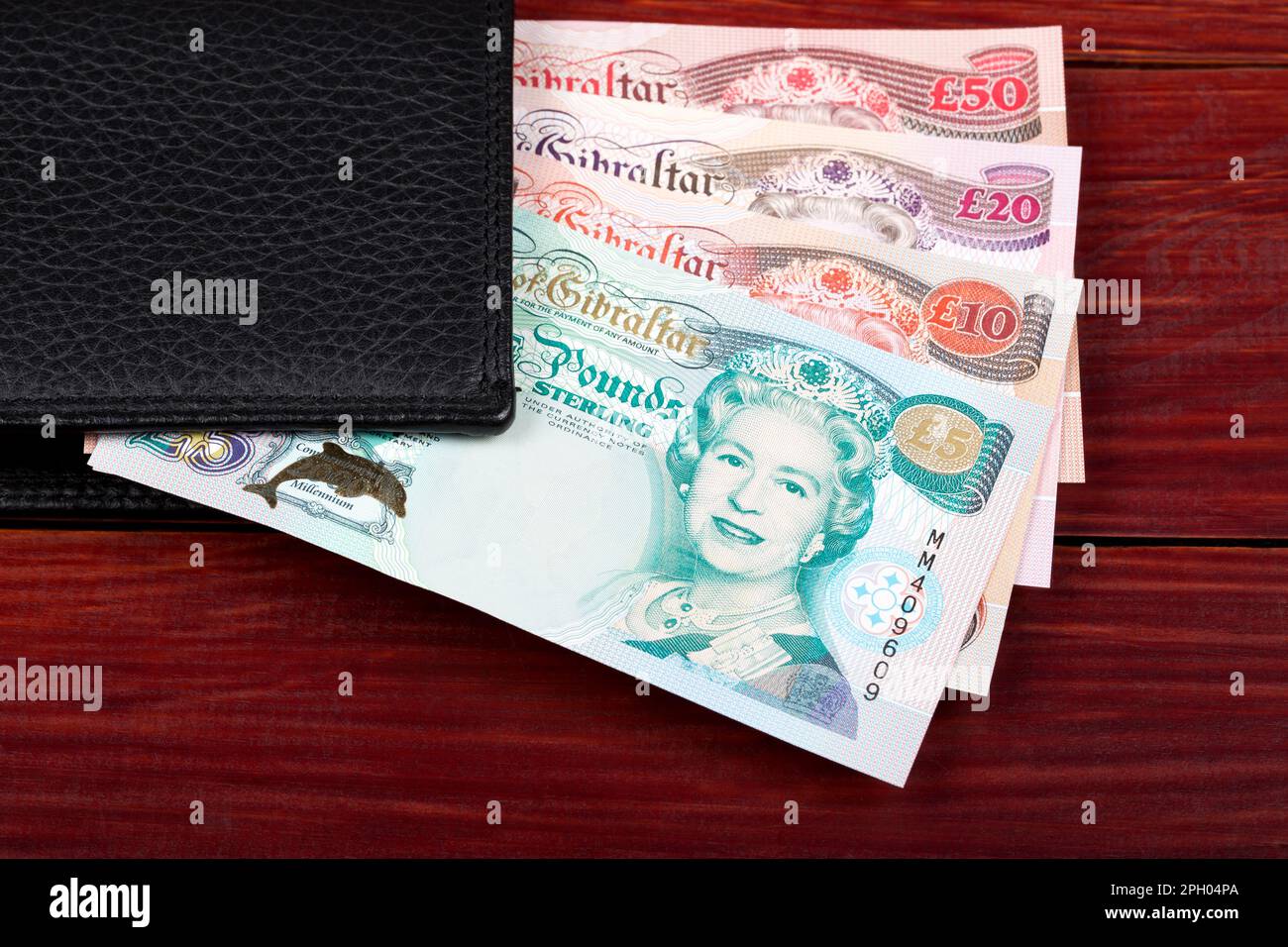 Gibraltar money - Pounds, older serie in the black wallet Stock Photo ...