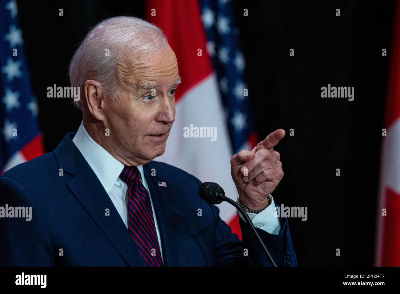 U.S. President Joe Biden points at a journalists as he speaks during a ...