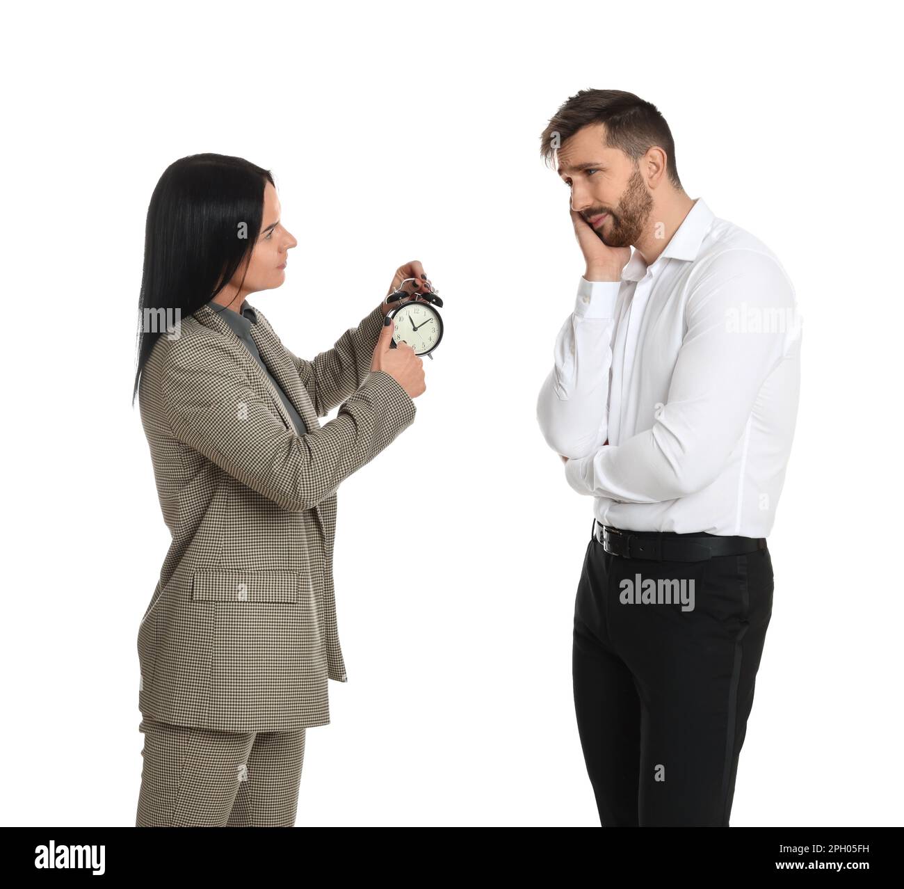 Business woman with alarm clock scolding employee for being late on ...