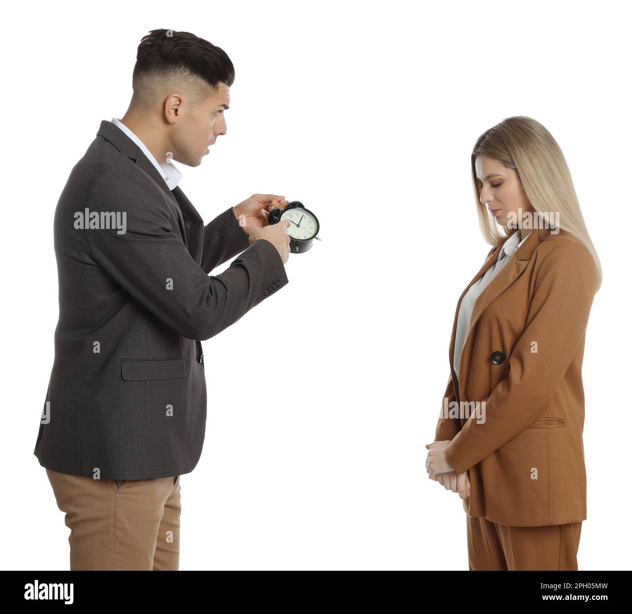 Businessman with alarm clock scolding employee for being late on white ...