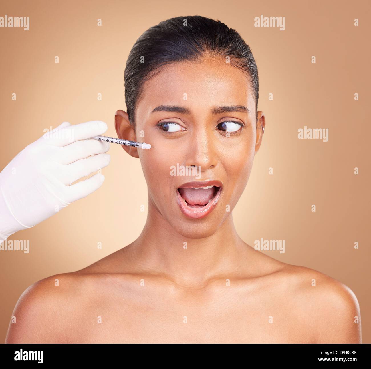 Woman, needle and face in studio with fear of pain with cosmetics ...
