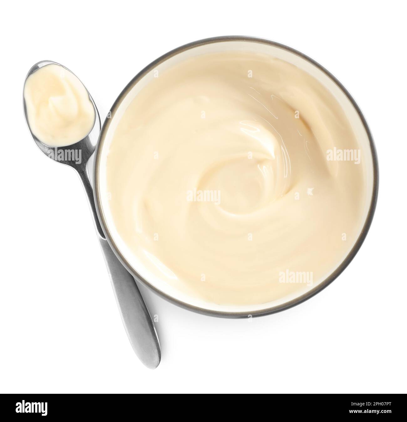 Ceramic bowl and spoon with mayonnaise on white background Stock Photo ...