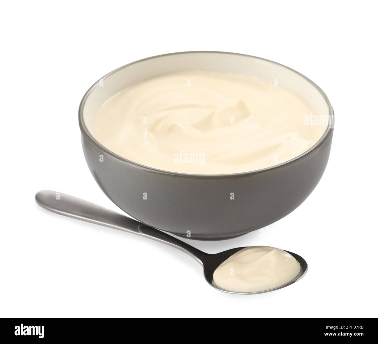 Ceramic bowl and spoon with mayonnaise on white background Stock Photo ...